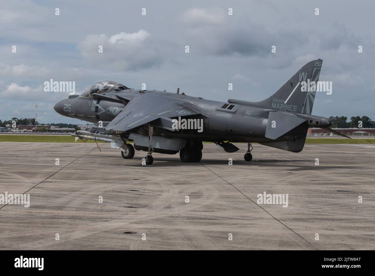 Marines with Marine Attack Squadron (VMA) 223 taxi an AV-B Harrier II ...
