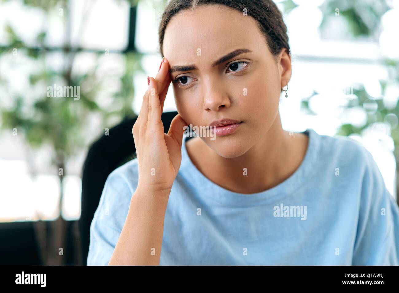 Close-up of exhausted tired sad mixed race young business woman, feels ...
