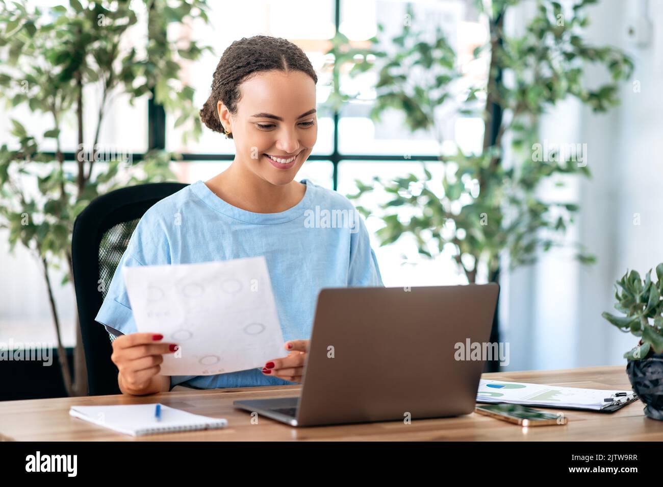 Positive smart brazilian or hispanic young businesswoman, secretary ...