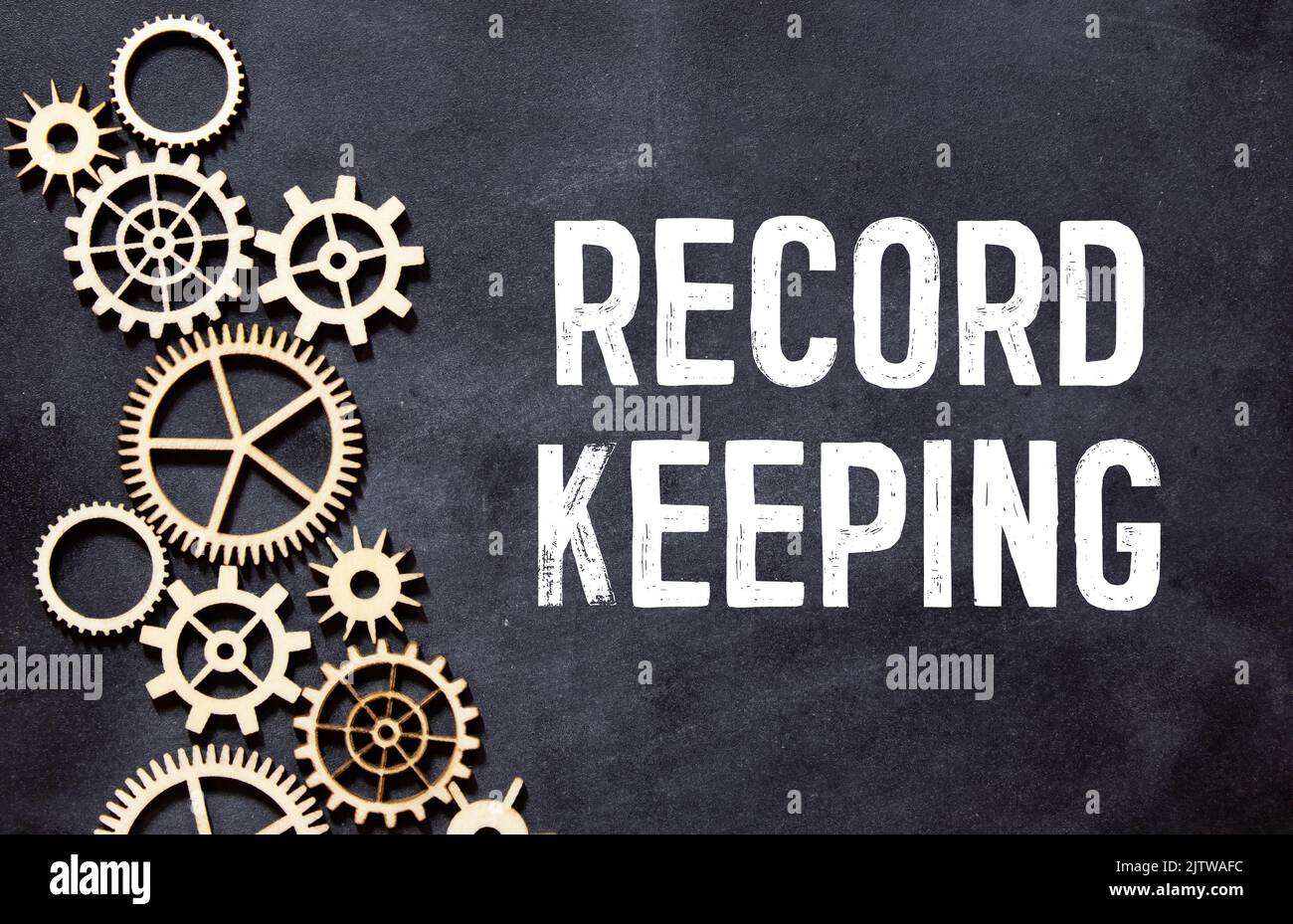 text record keeping on white paper card, black ahd red letters. lens on ...