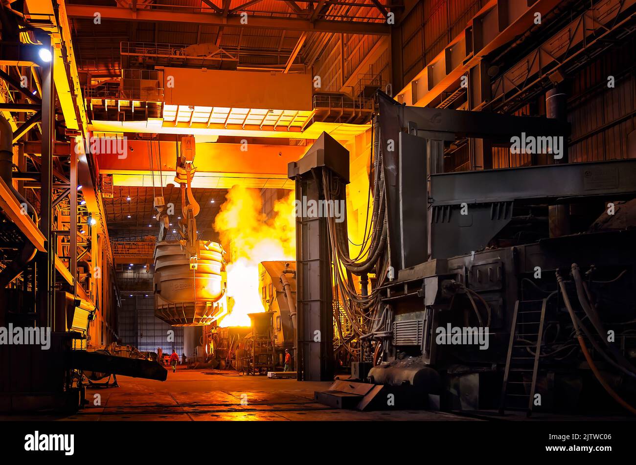 Scrap metal is transferred to an electric arc furnace in the melt shop ...