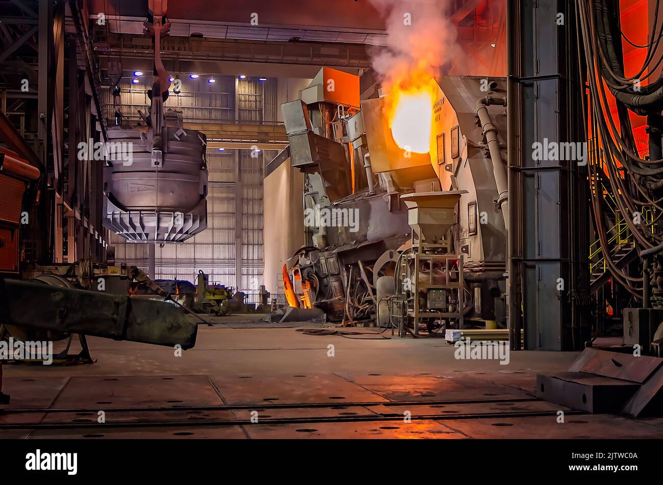 Scrap metal is transferred to an electric arc furnace in the melt shop ...