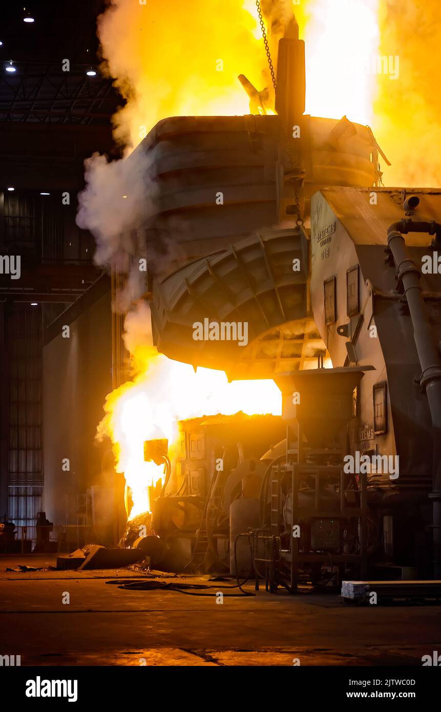 Scrap metal is transferred to an electric arc furnace in the melt shop ...