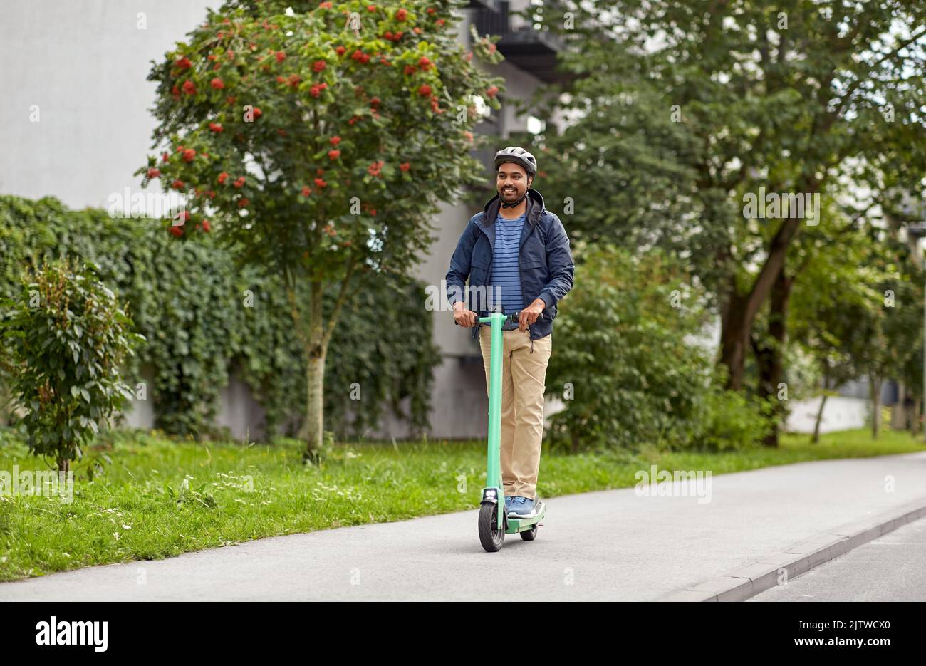 Happy man on scooter hi-res stock photography and images - Alamy