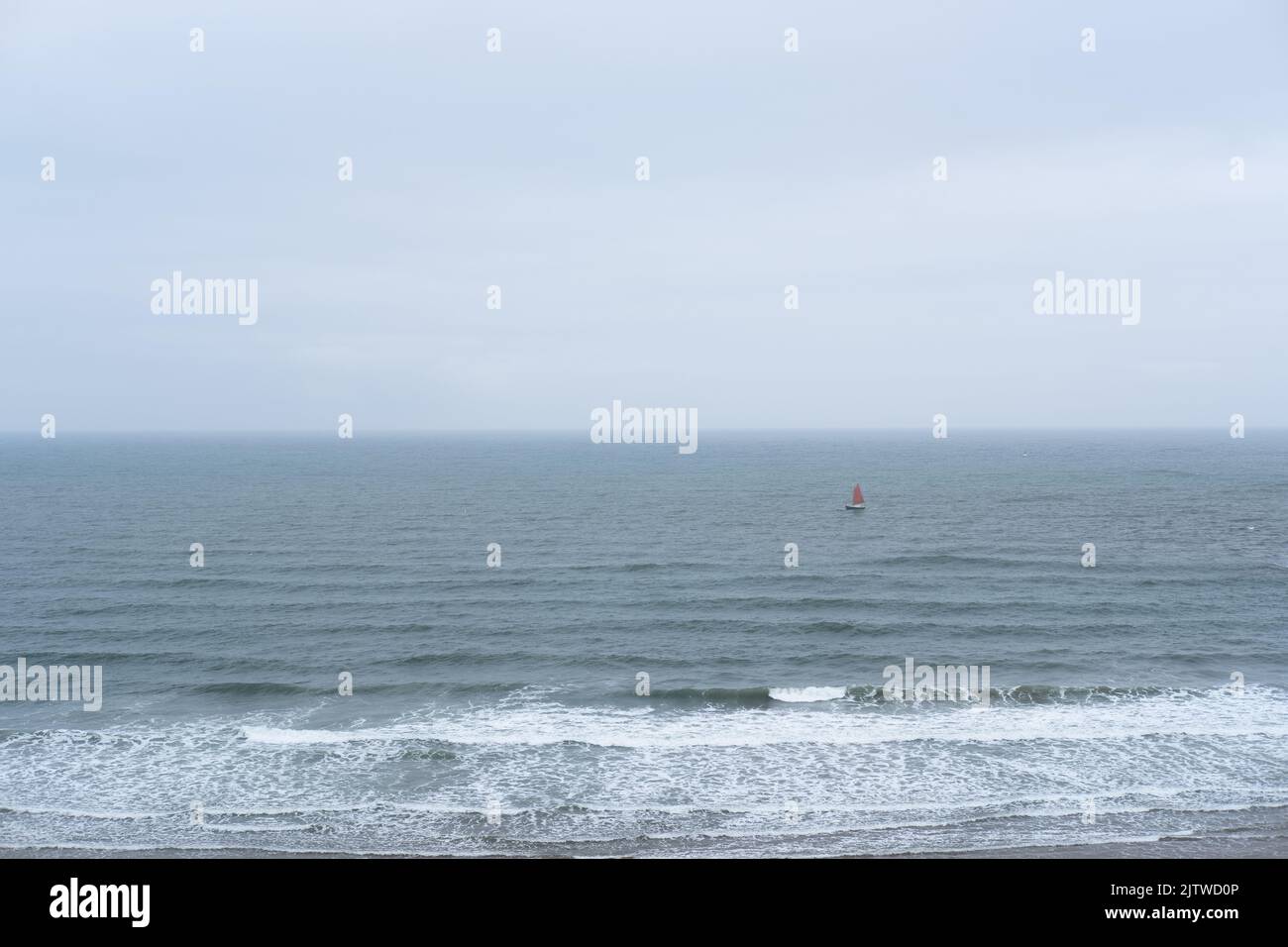A sailing boat, alone in the sea Stock Photo - Alamy
