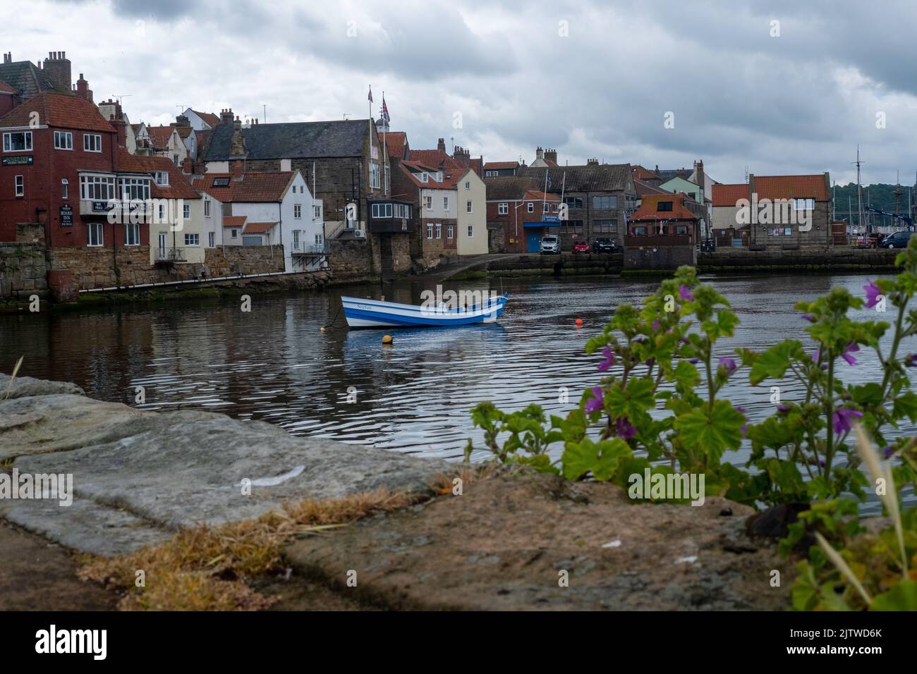 A view of part of Whitby Harbour with small fishing boat Stock Photo ...