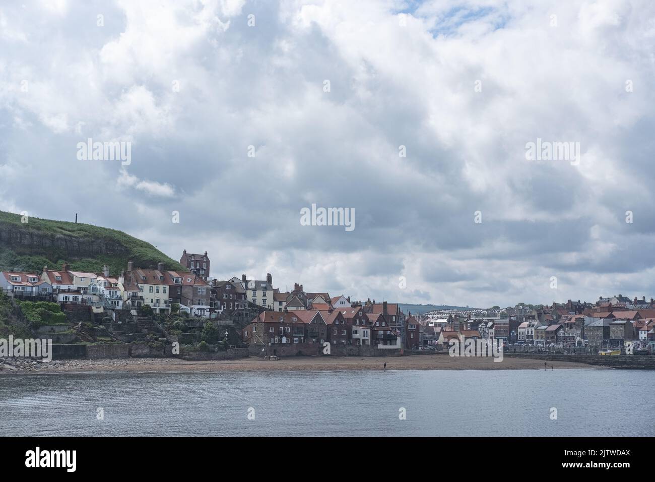 Townscape view of Whitby from Sea, below magnificent sky and clouds ...