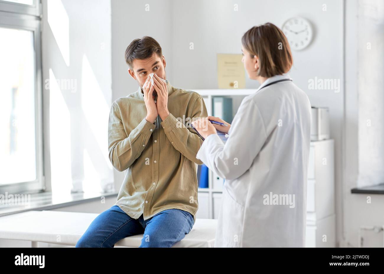 Doctor blowing nose hi-res stock photography and images - Alamy