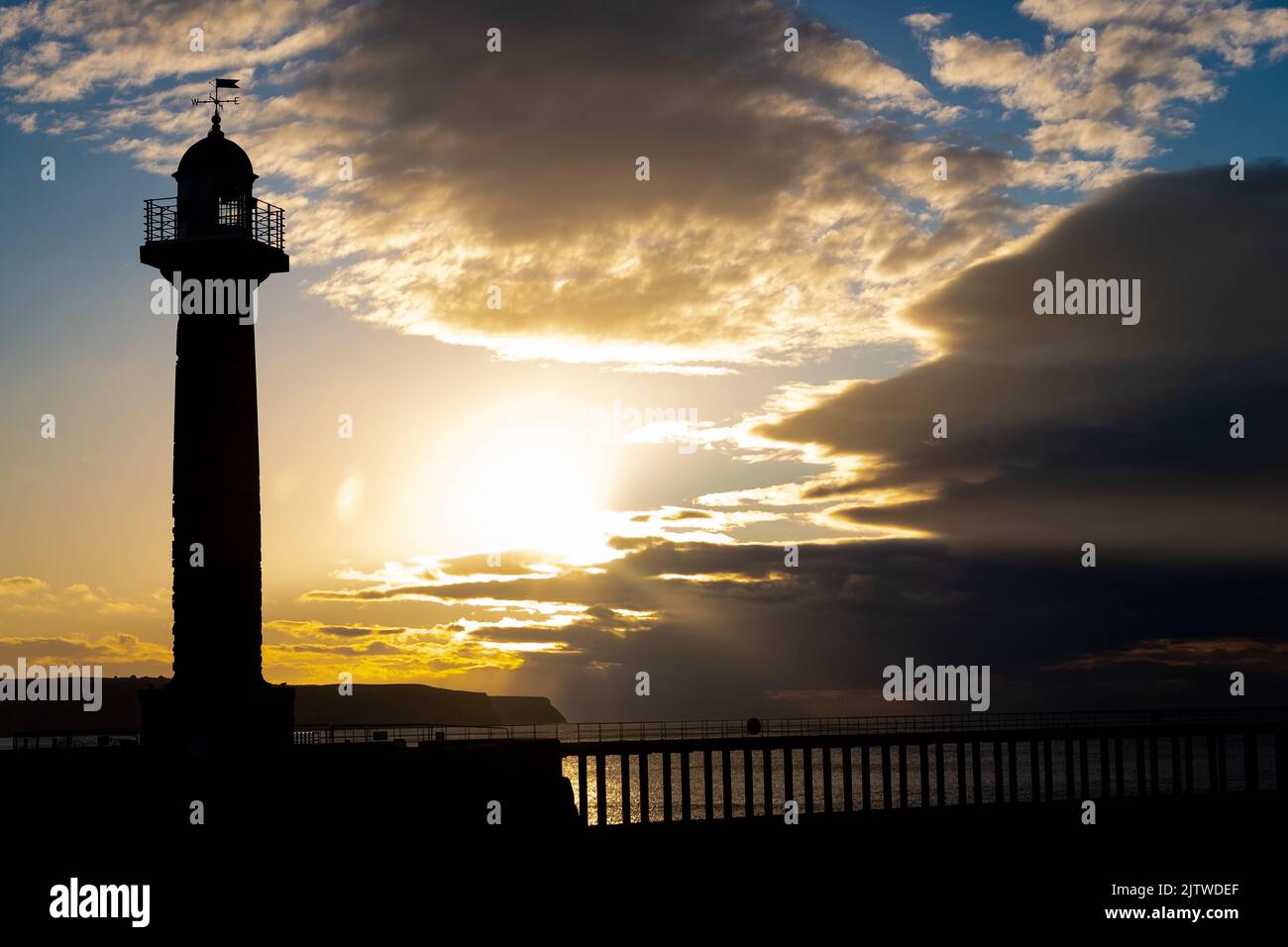 Silhouette of Whitby West Lighthouse and Pier Stock Photo - Alamy