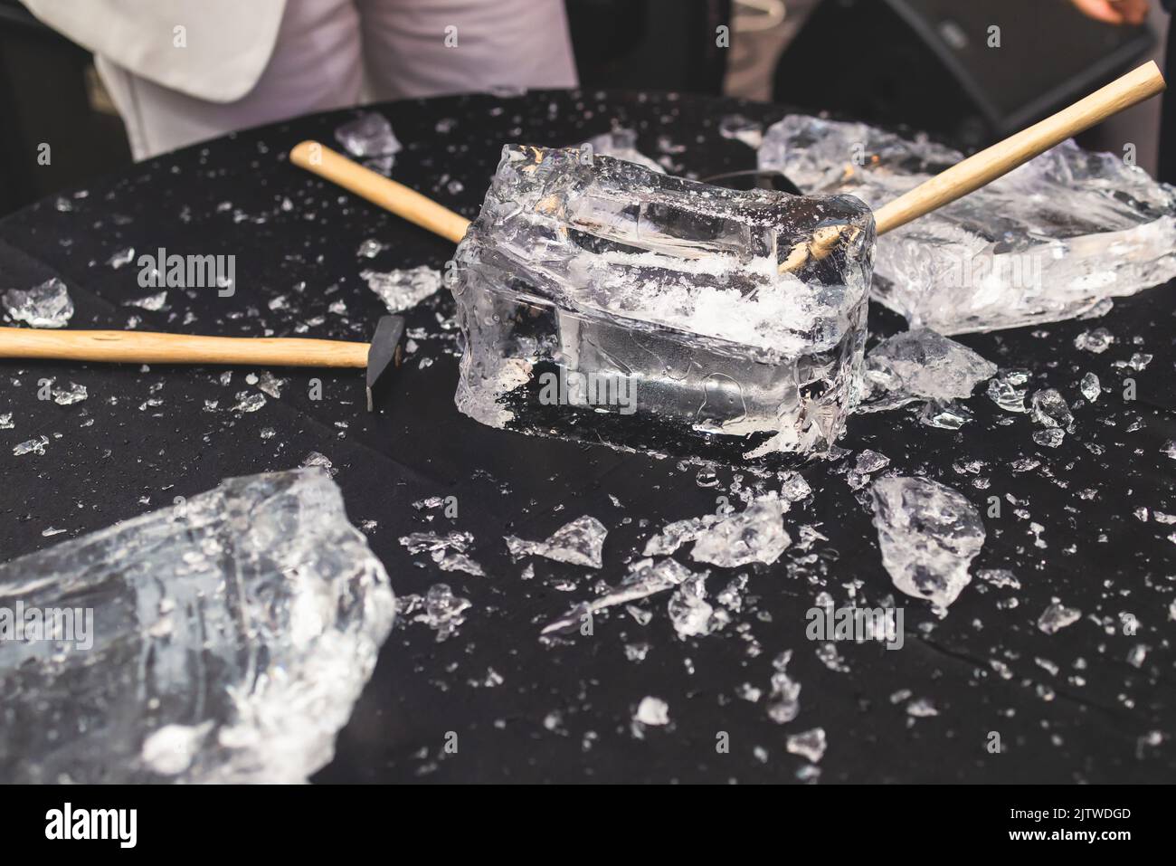 Process of breaking the ice with hammer and ice pick, group of people ...