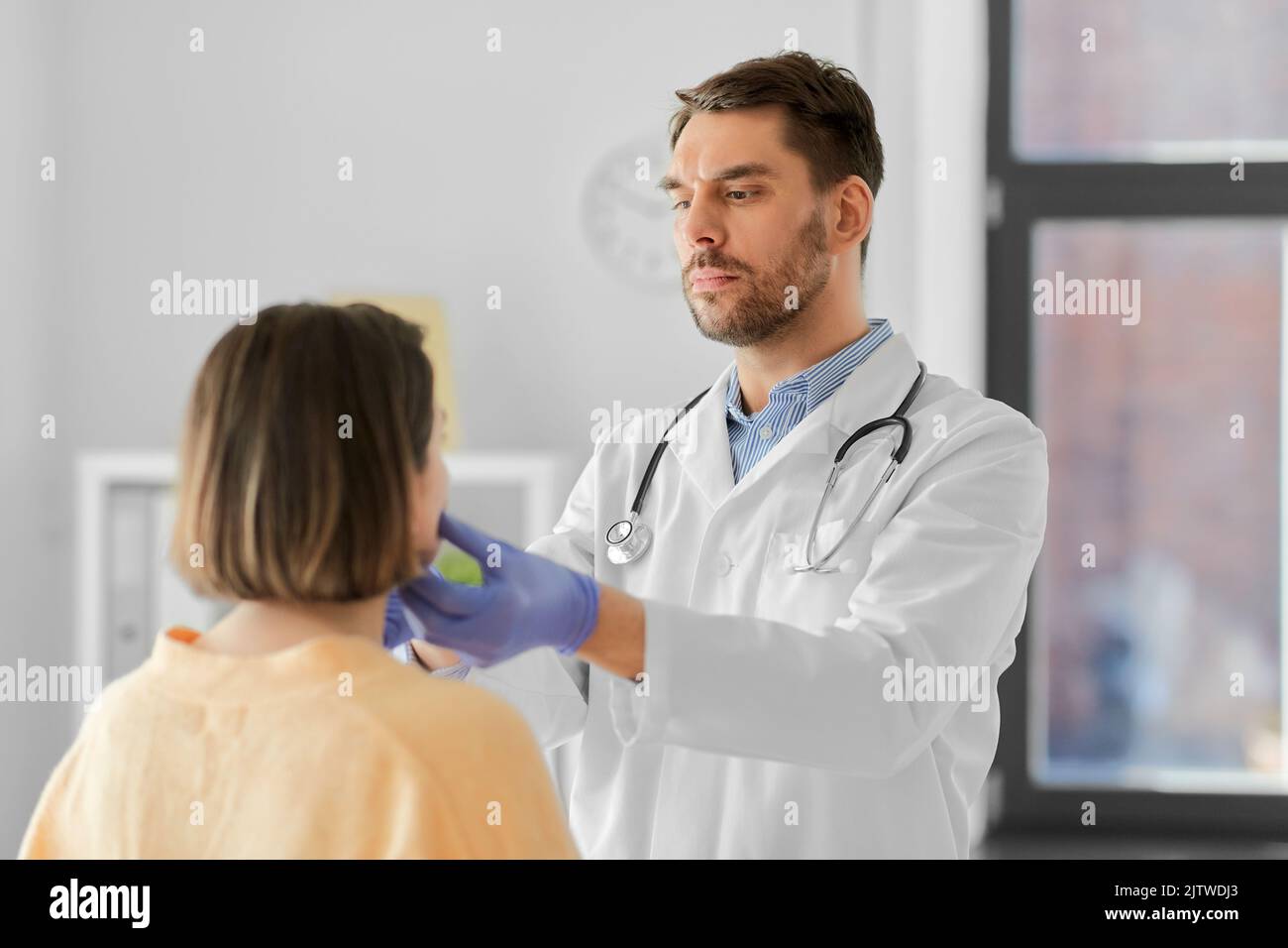 doctor checking lymph nodes of woman at hospital Stock Photo - Alamy