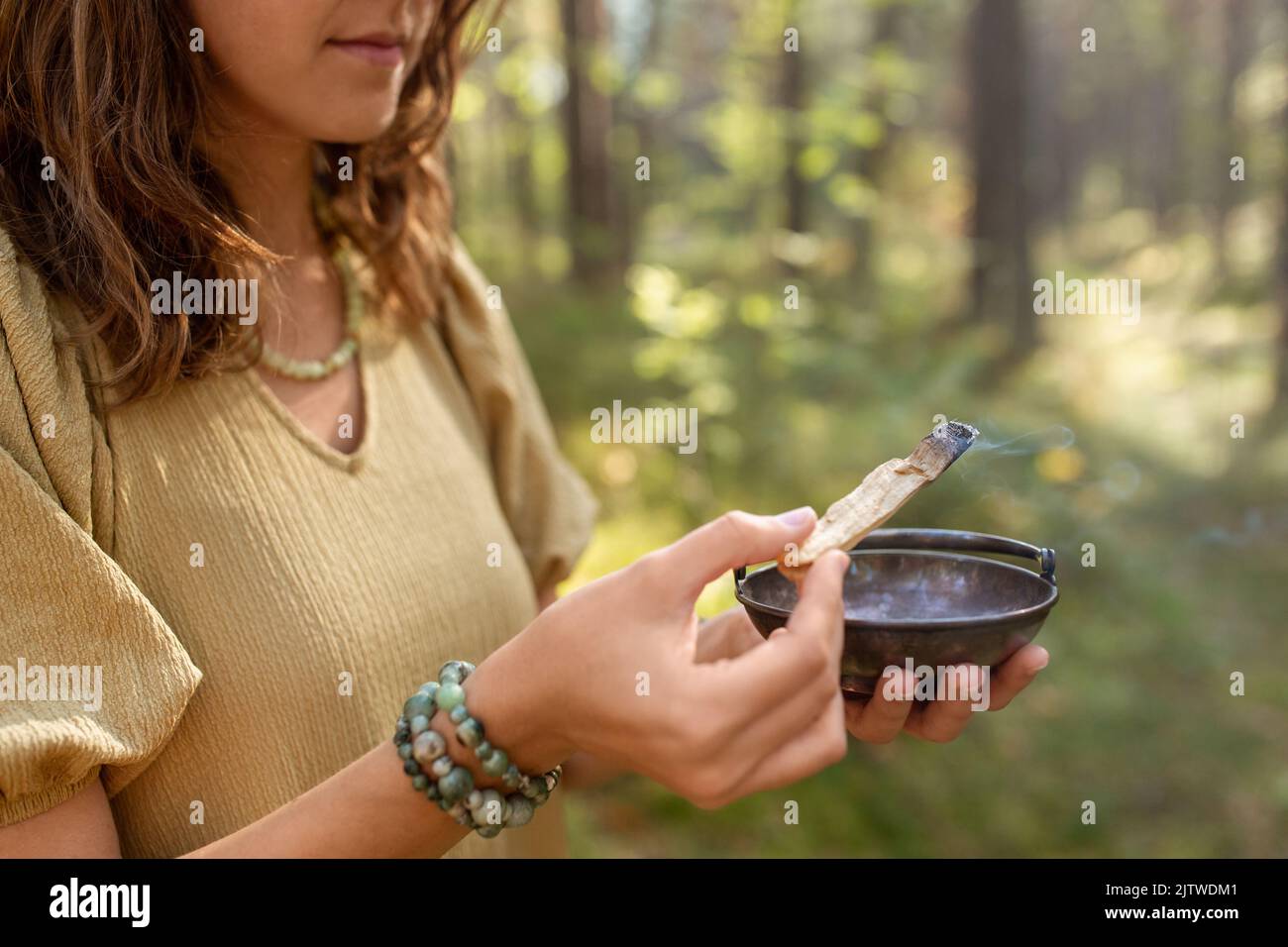 woman with palo santo performing magic ritual Stock Photo - Alamy