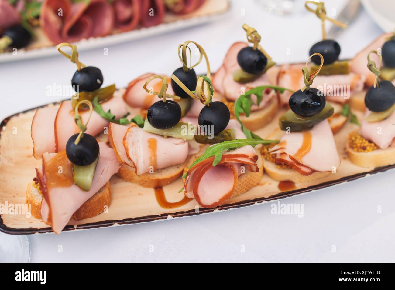 Catering table, beautifully decorated banquet with variety selection of different food snacks ...