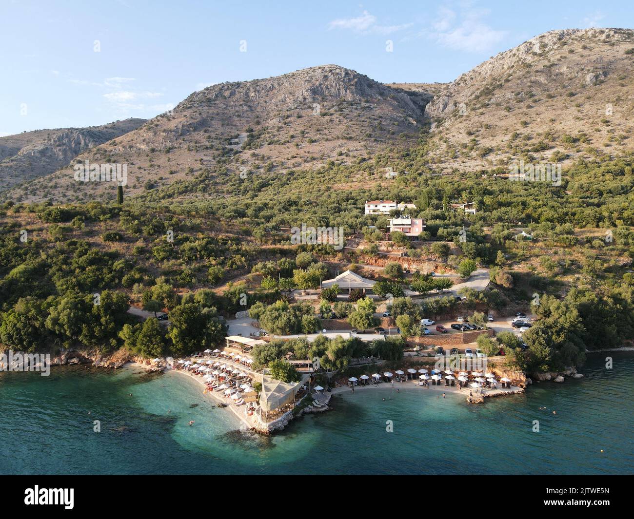 aerial drone view of kokkinos vrachos, red rock, crystal clear water ...