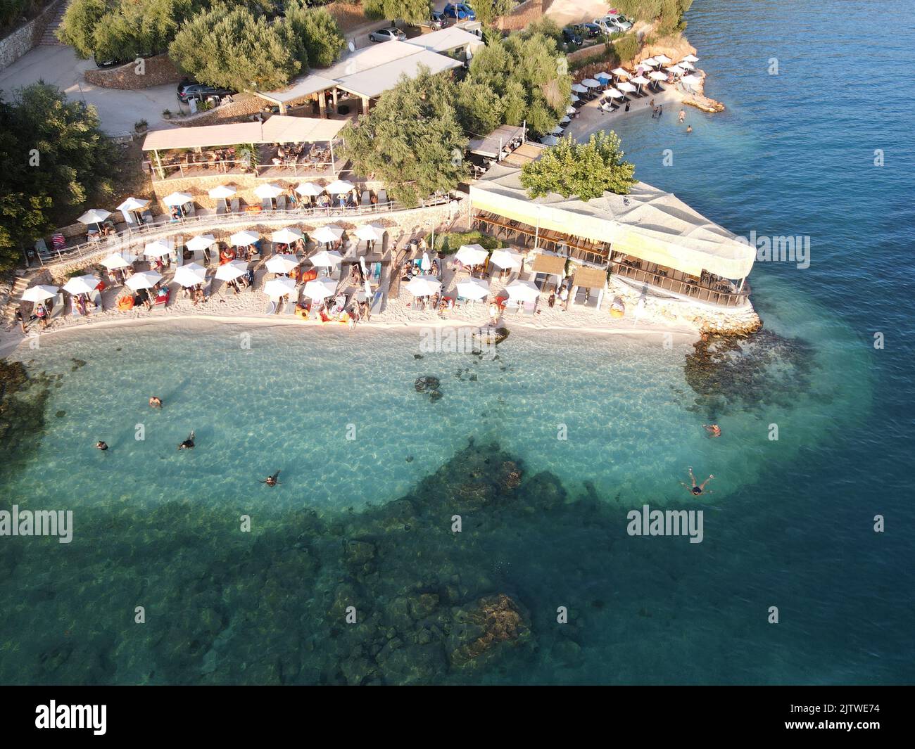 aerial drone view of kokkinos vrachos, red rock, crystal clear water ...