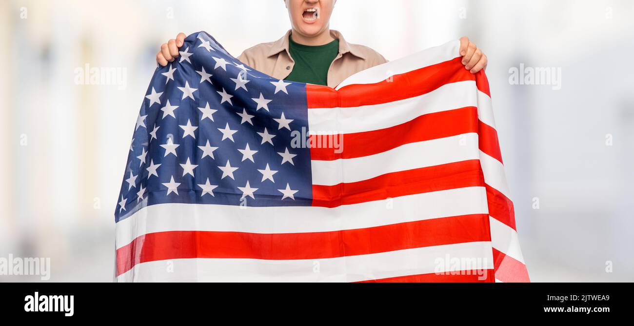 screaming woman holding flag of america on street Stock Photo - Alamy