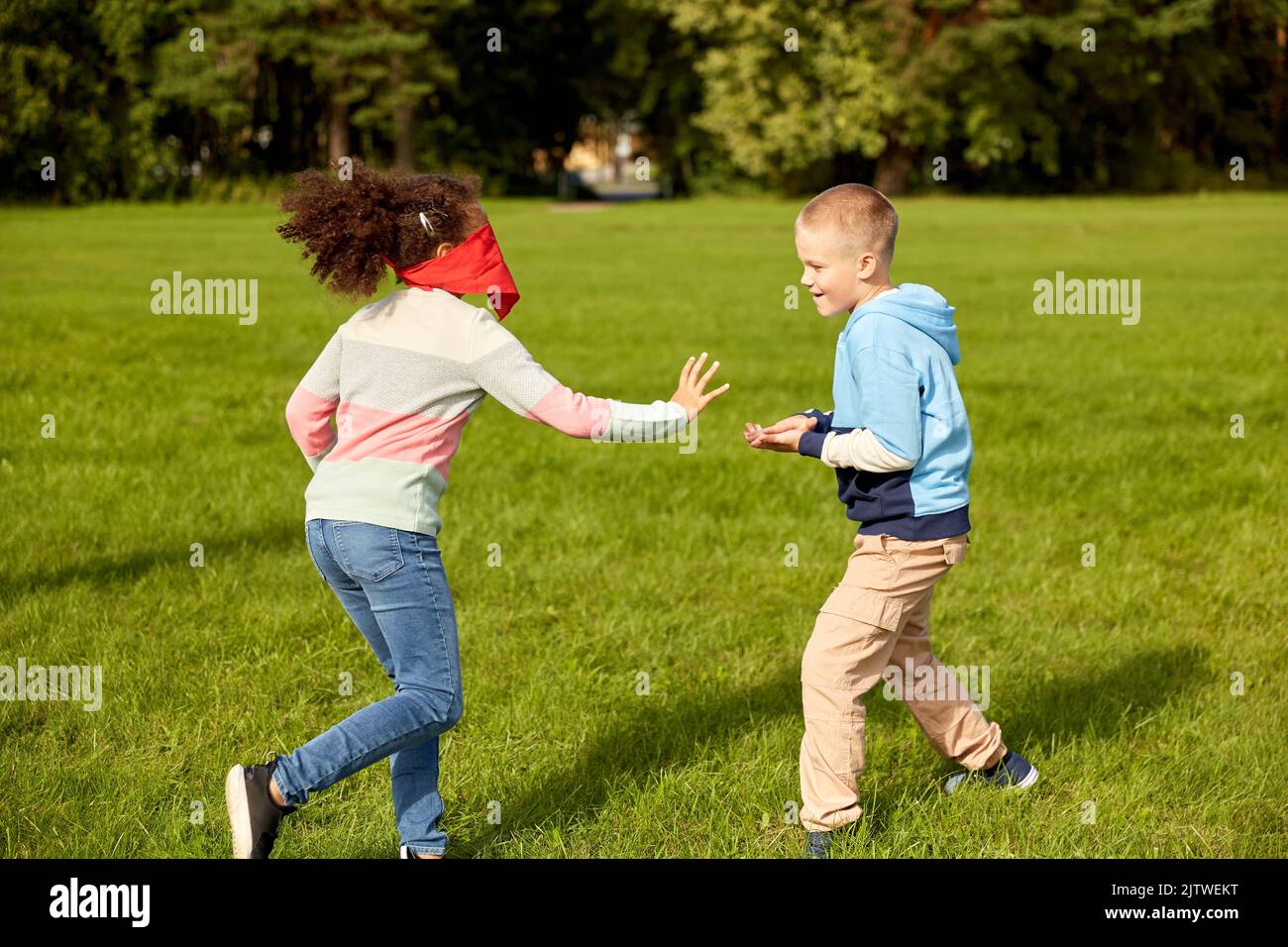 happy children playing and running at park Stock Photo - Alamy