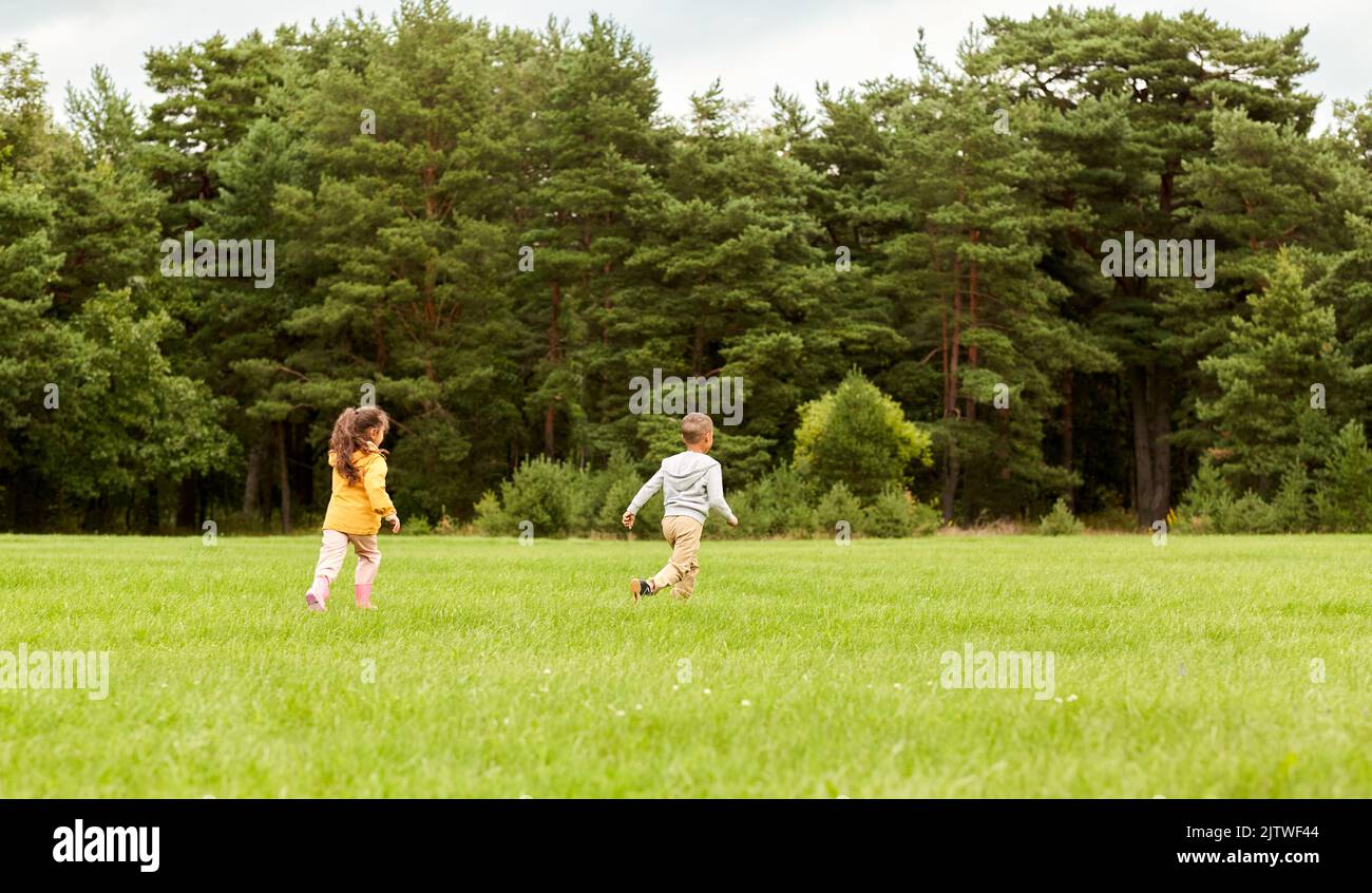 children playing and running at park Stock Photo - Alamy