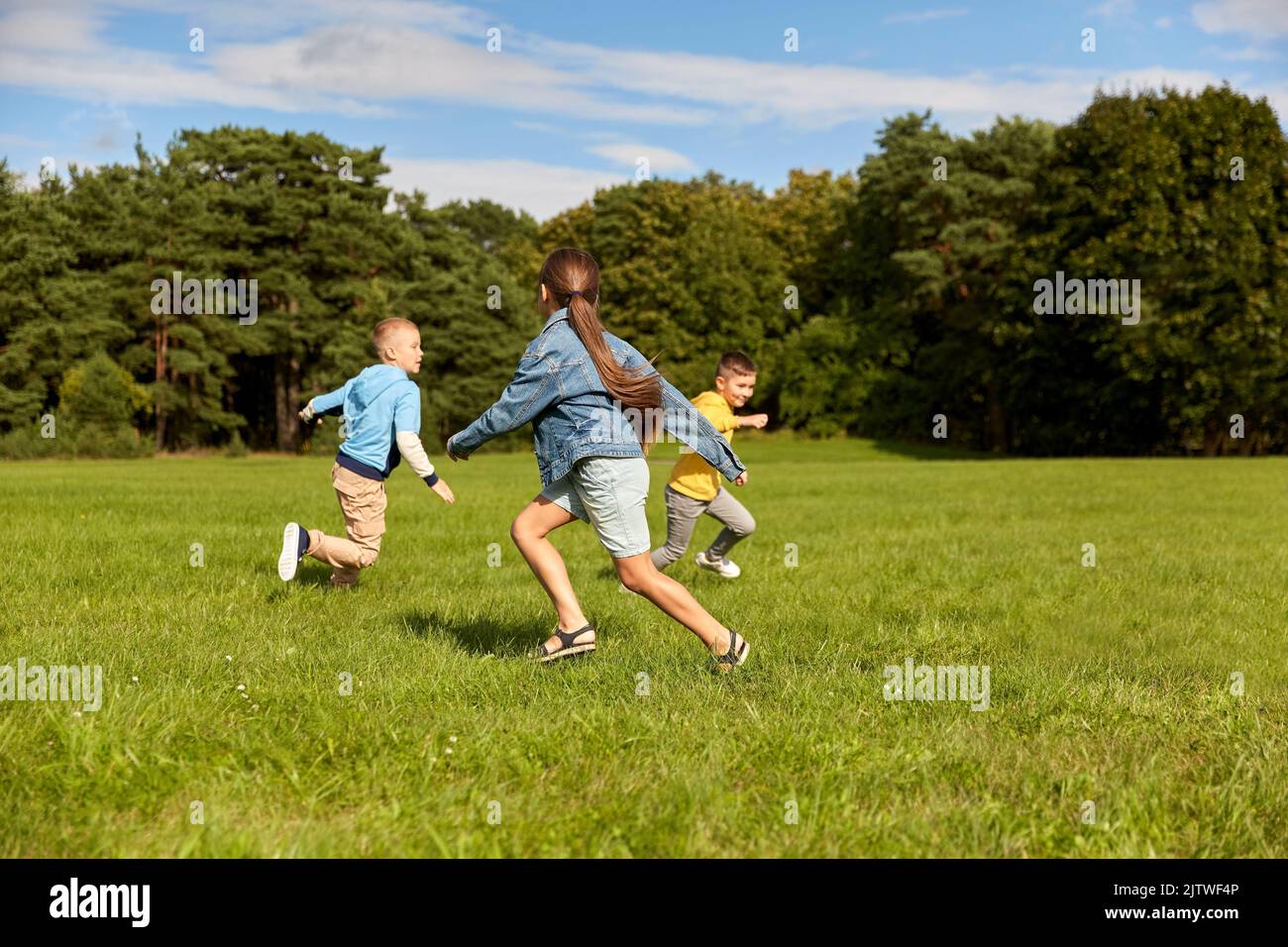 happy children playing and running at park Stock Photo - Alamy