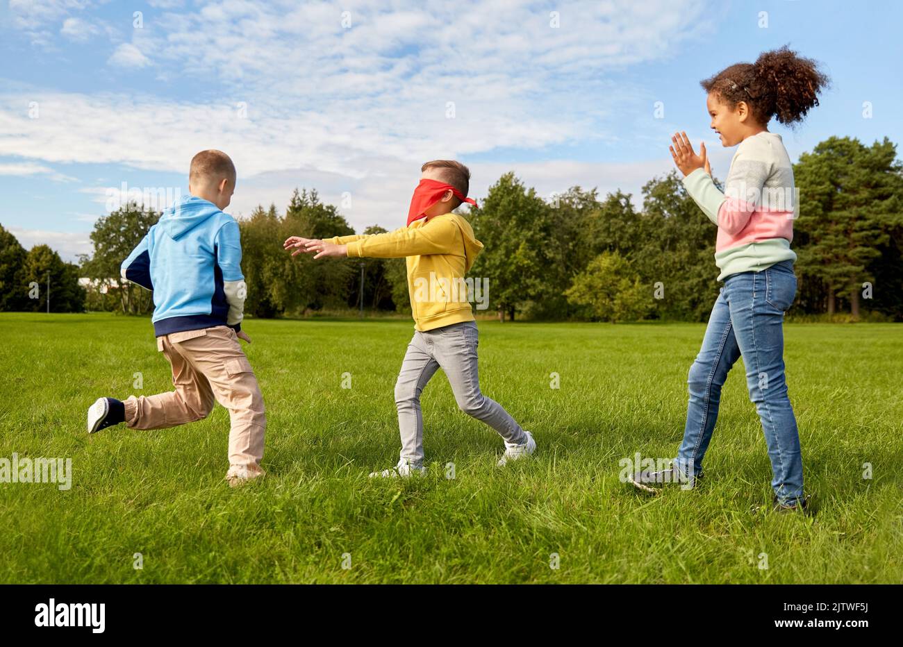 happy children playing and running at park Stock Photo - Alamy
