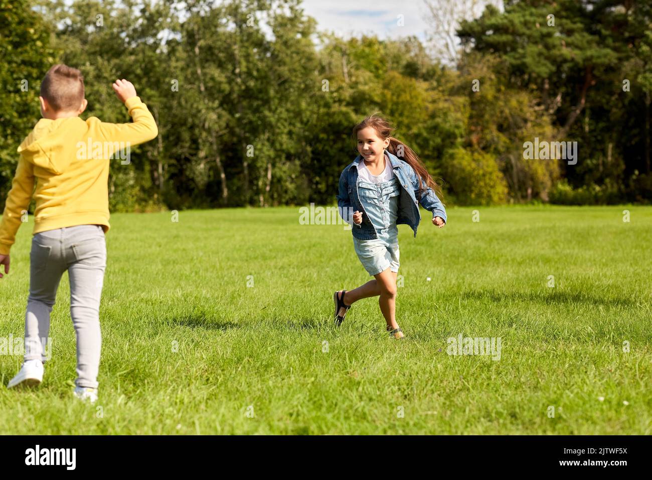 happy children playing and running at park Stock Photo - Alamy