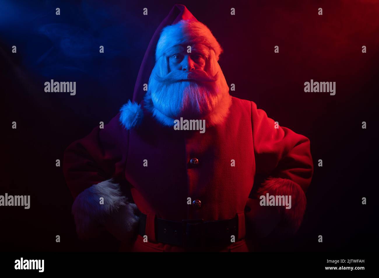 Santa Claus portrait in blue red neon light and smoke Stock Photo - Alamy