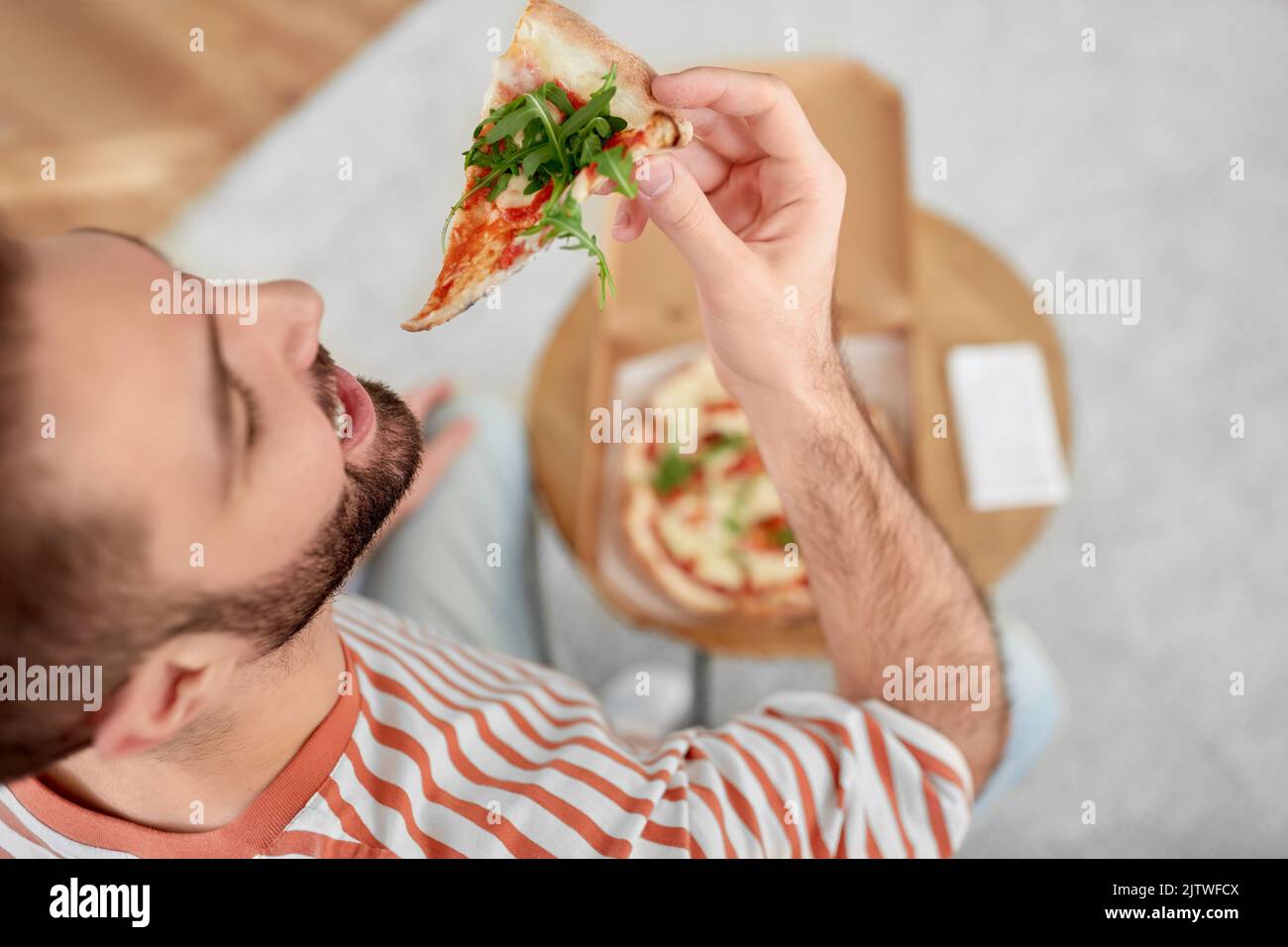 happy man eating takeaway pizza at home Stock Photo - Alamy happy man eating takeaway pizza at home Stock Photo - Alamy
