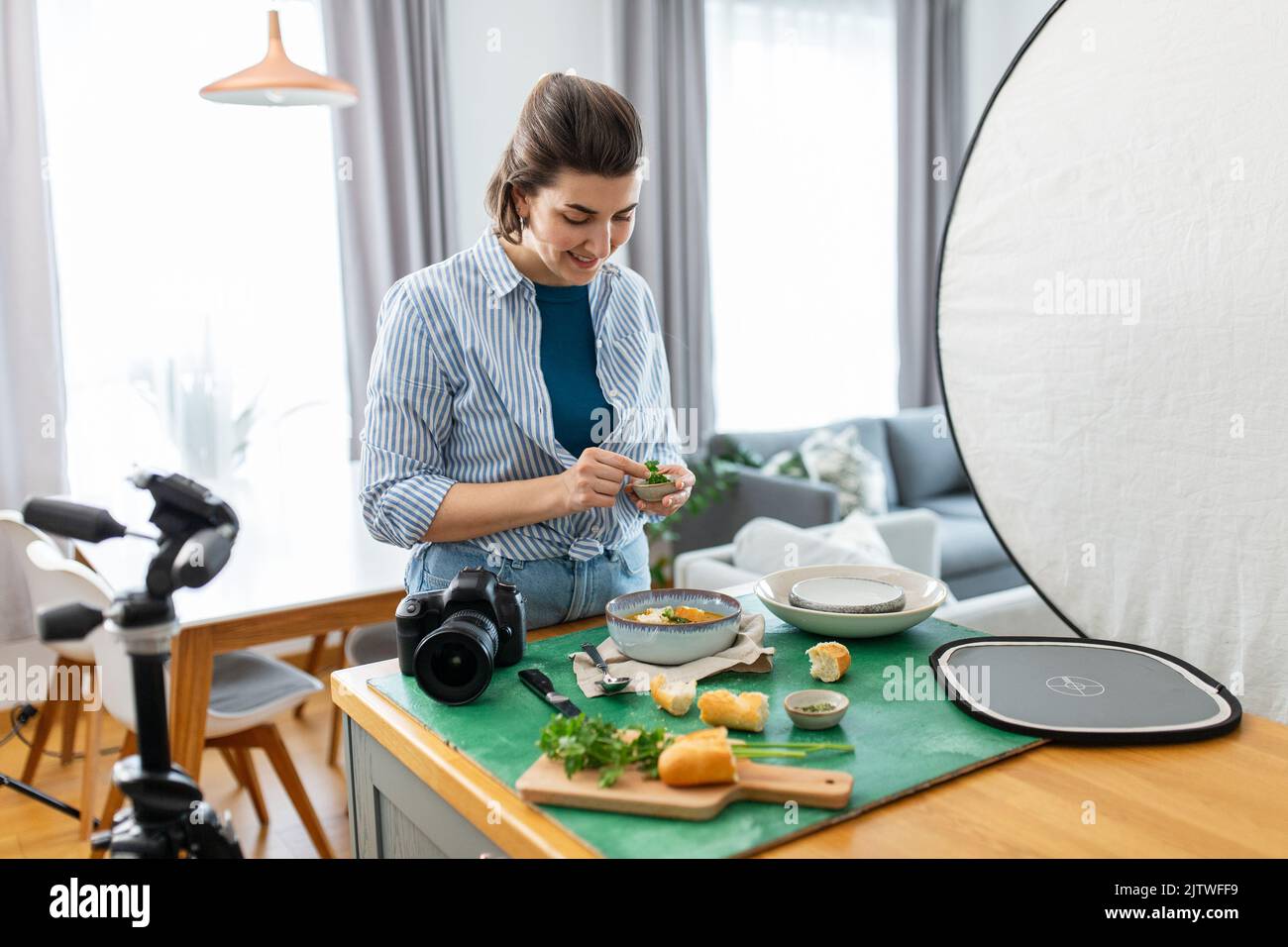 food photographer with camera working in kitchen Stock Photo - Alamy