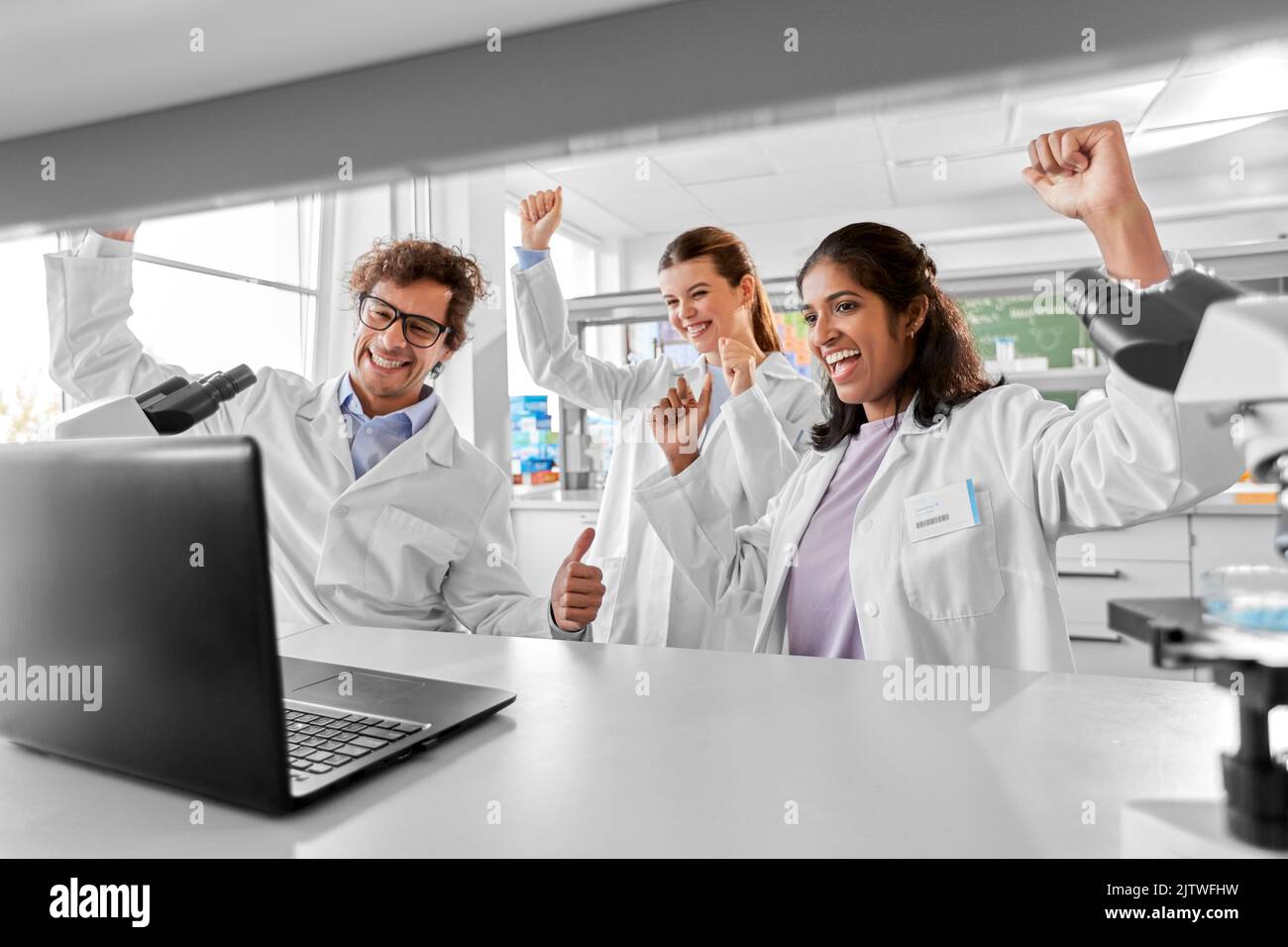 Happy female celebrating success working hi-res stock photography and ...