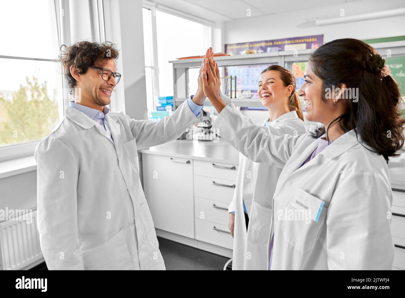happy international scientists in laboratory Stock Photo - Alamy