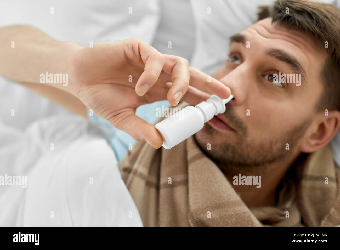 Man lying ill in bed hi-res stock photography and images - Alamy