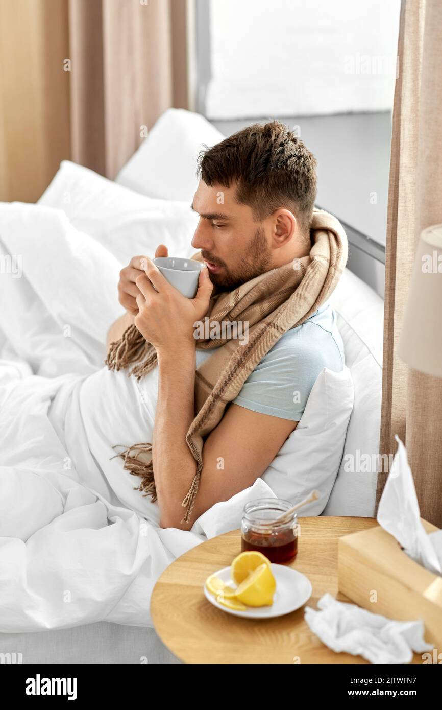 Sick man scarf drinking hi-res stock photography and images - Alamy