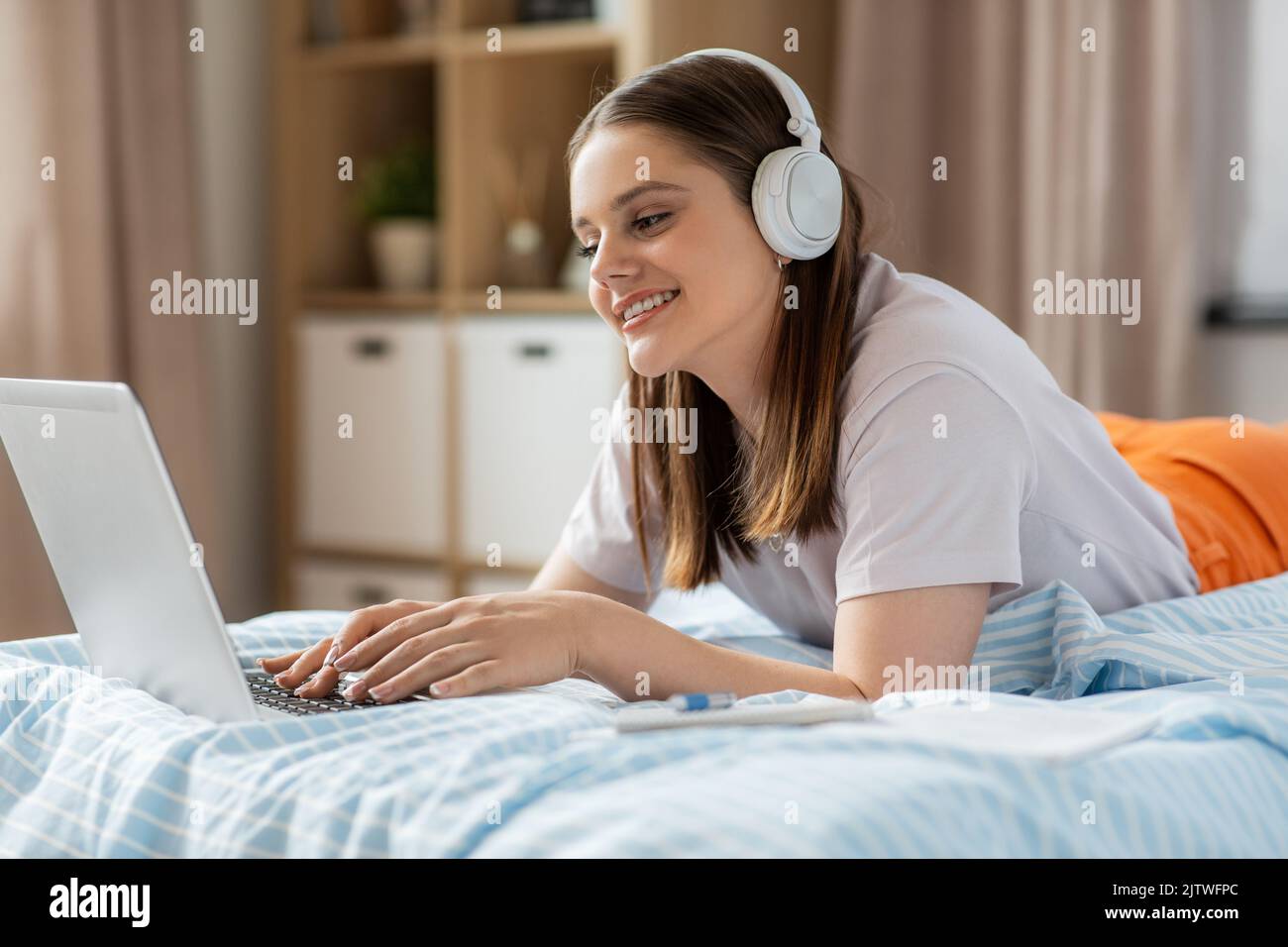 happy student girl in headphones learning at home Stock Photo - Alamy