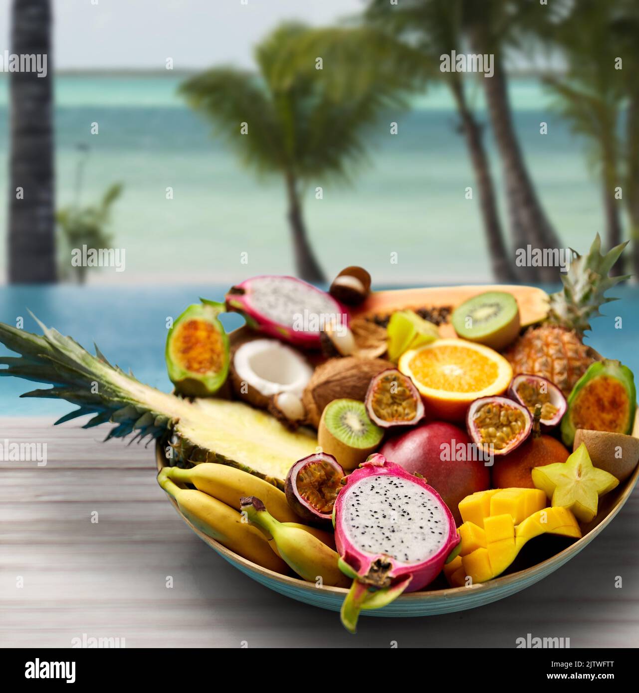 plate of exotic fruits on tropical beach Stock Photo - Alamy
