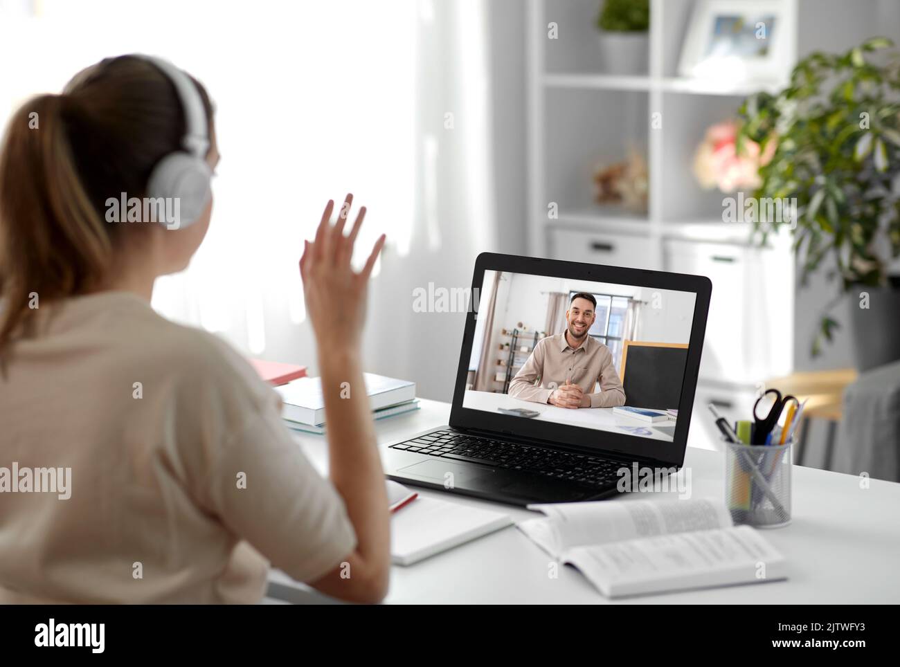 student with laptop having online class at home Stock Photo - Alamy