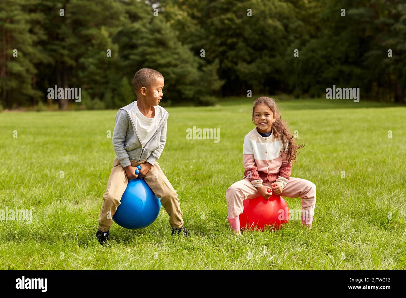 Child bouncing ball hi-res stock photography and images - Alamy