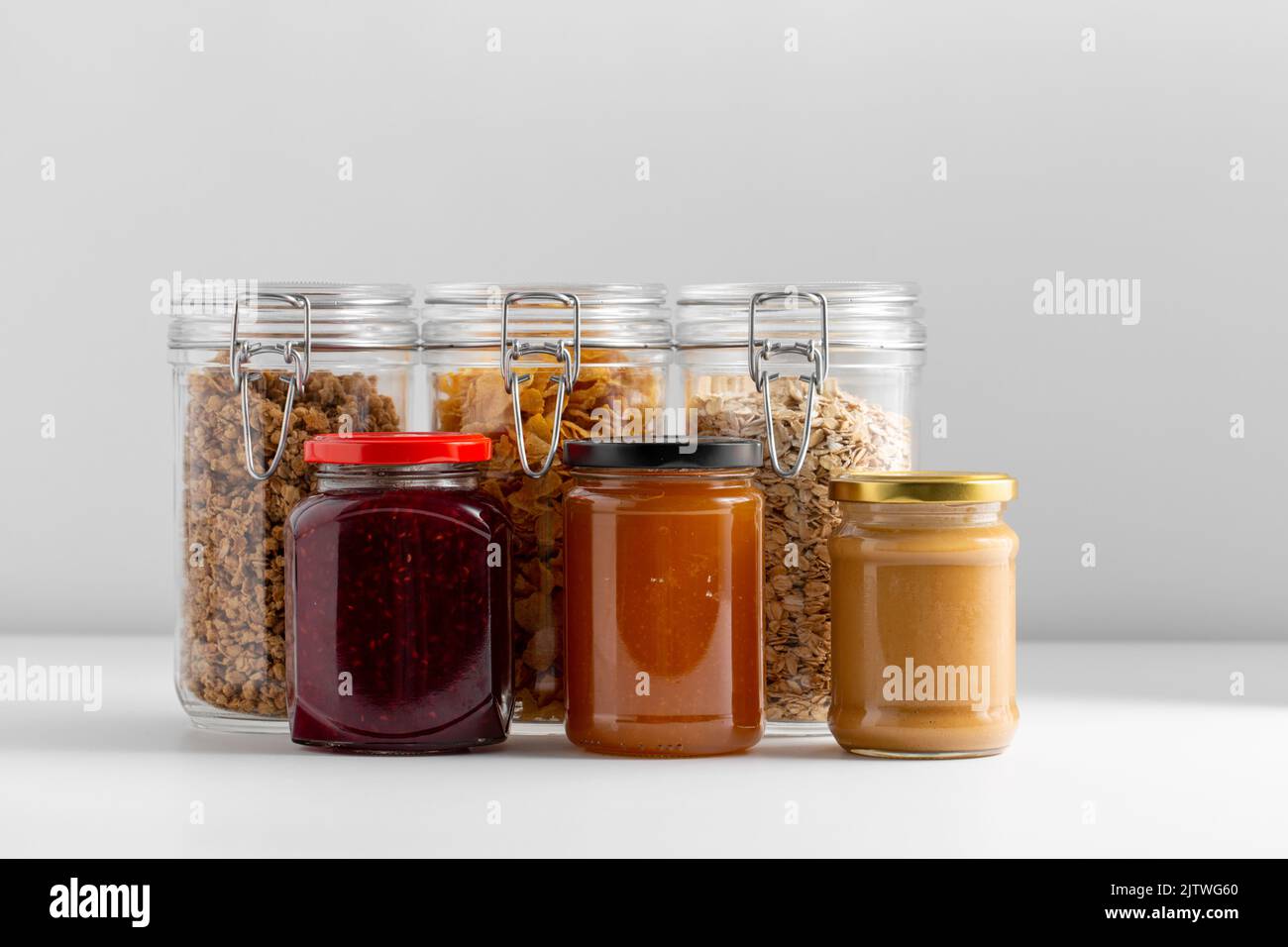 close up of preserves and cereals on table Stock Photo - Alamy