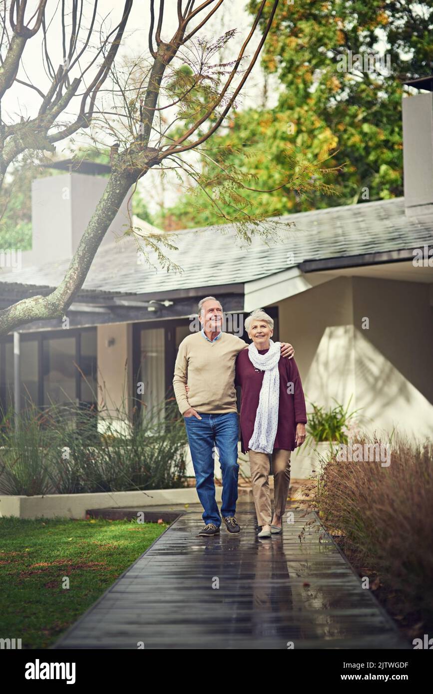Always by each others side. a loving senior couple taking a walk ...