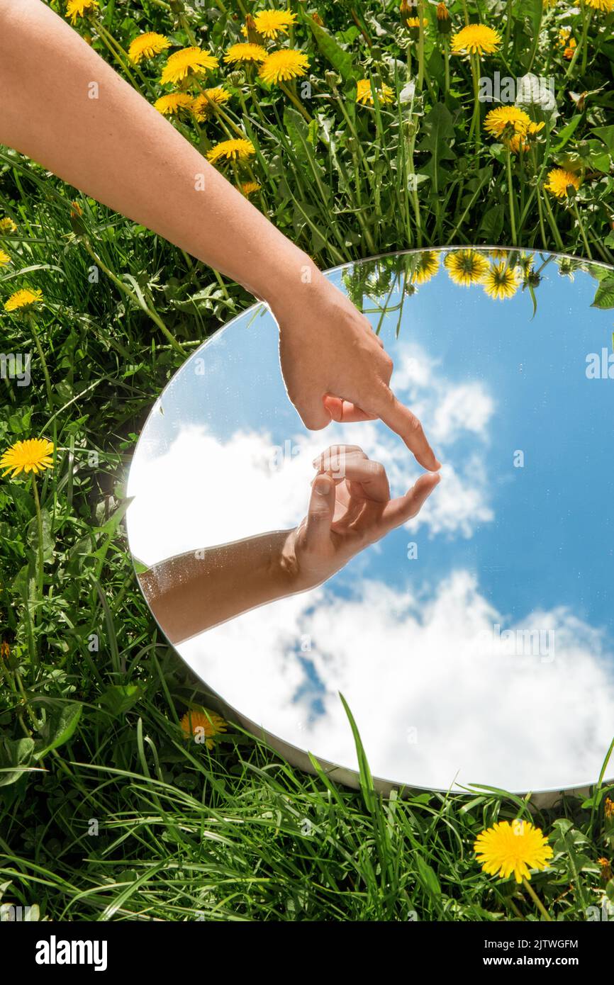 Hand touching mirror hi-res stock photography and images - Alamy