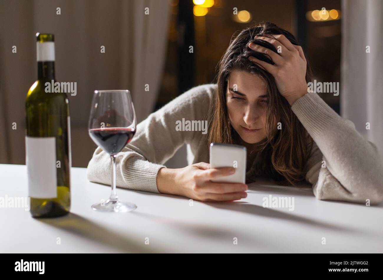 Drunk woman with wine bottle hi-res stock photography and images - Alamy
