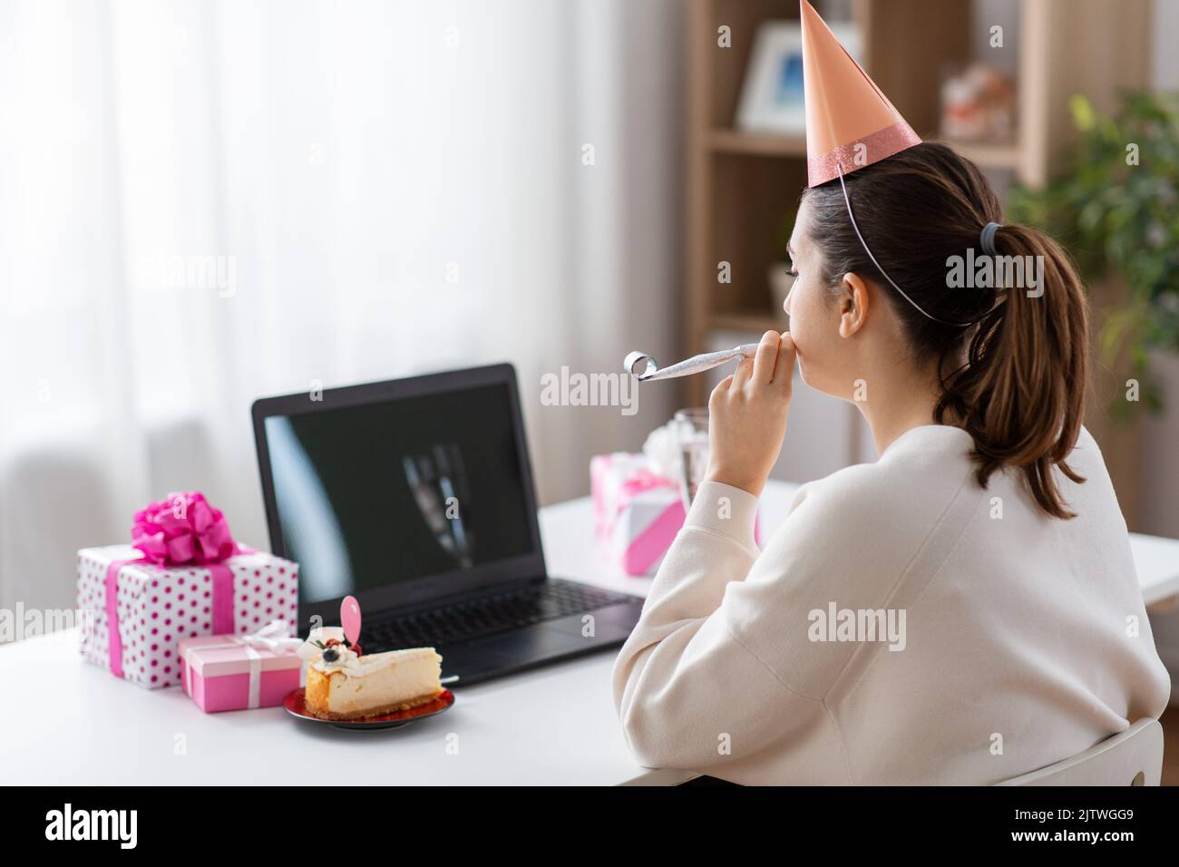 woman with laptop having virtual birthday party Stock Photo - Alamy
