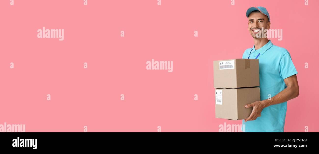 Delivery man with parcels on pink background with space for text Stock ...