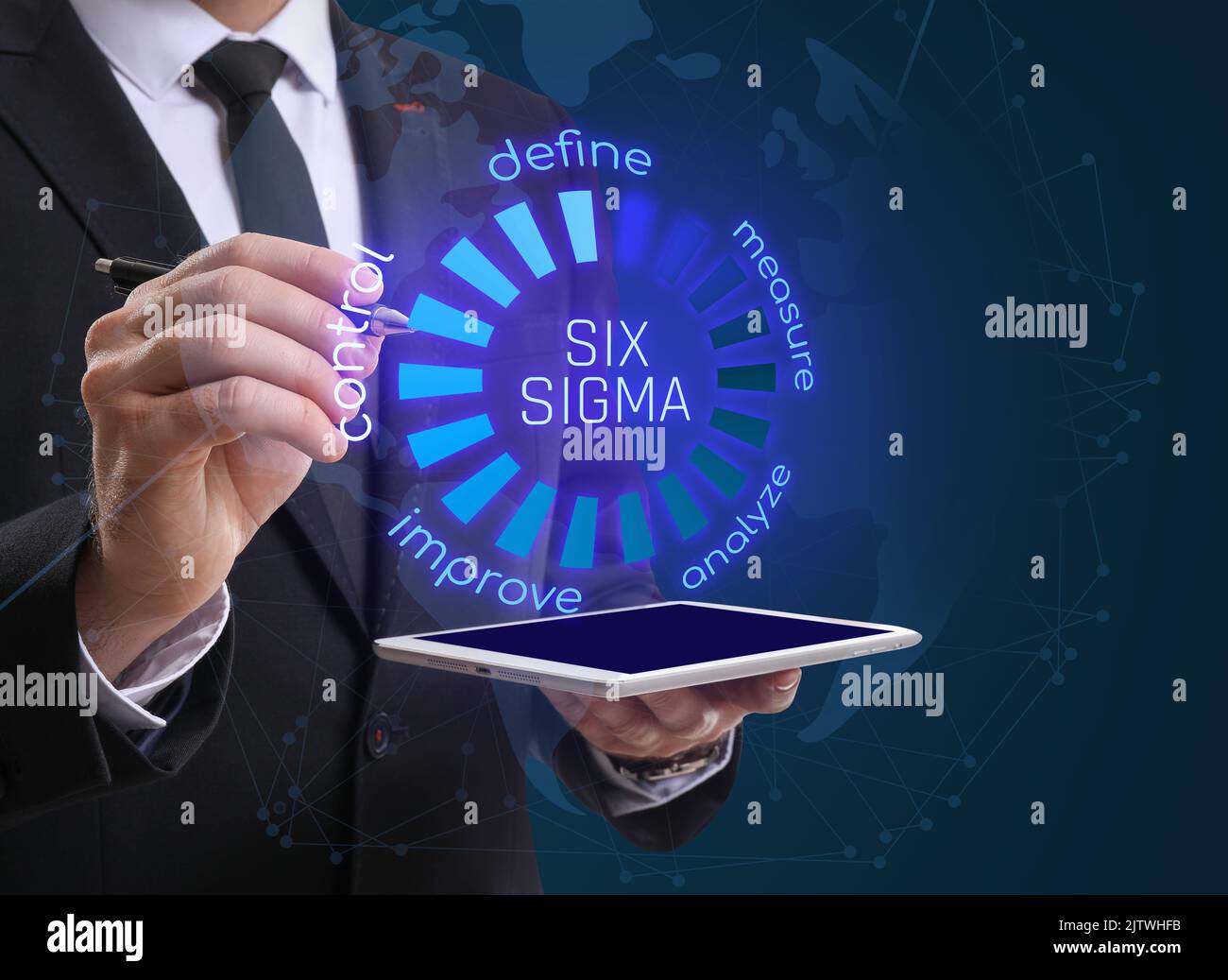 Businessman with tablet computer using virtual screen on black ...