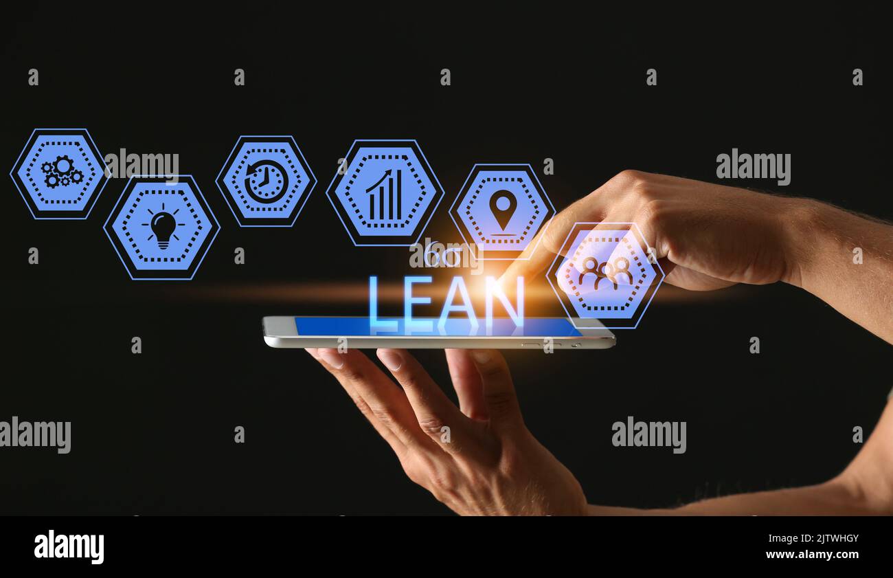 Man with tablet computer using virtual screen on black background. 6 ...