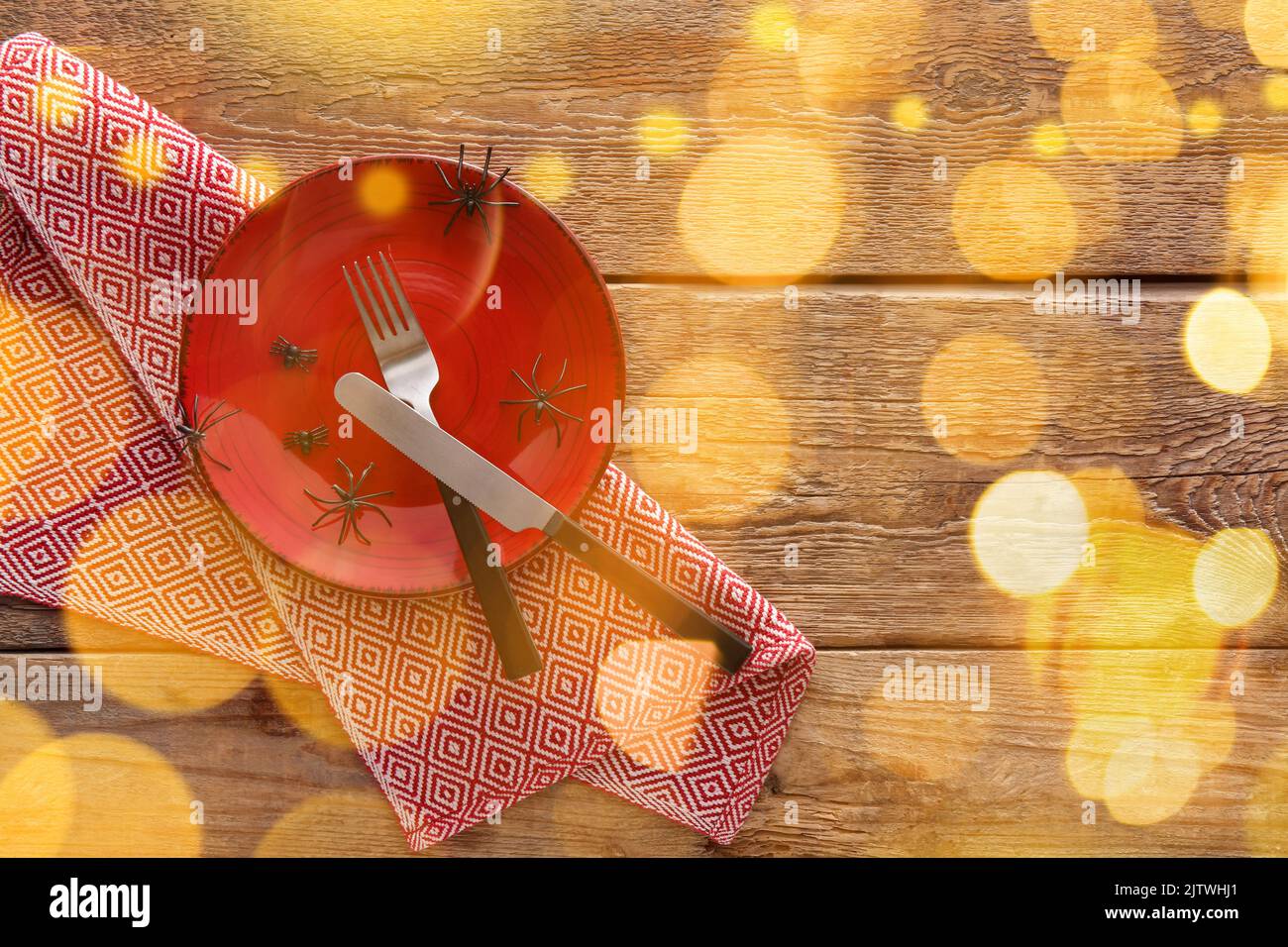 Halloween table setting with spiders on wooden background Stock Photo ...