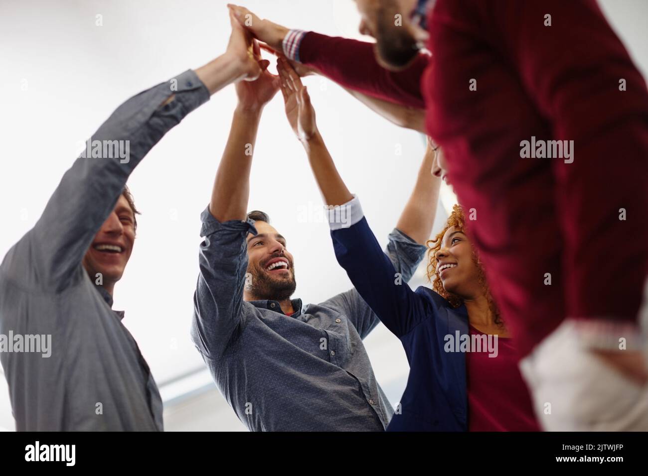 We Did It Again A Team Of Businesspeople Giving Each Other A High Five We Did It Again A Team Of Businesspeople Giving Each Other A High Five