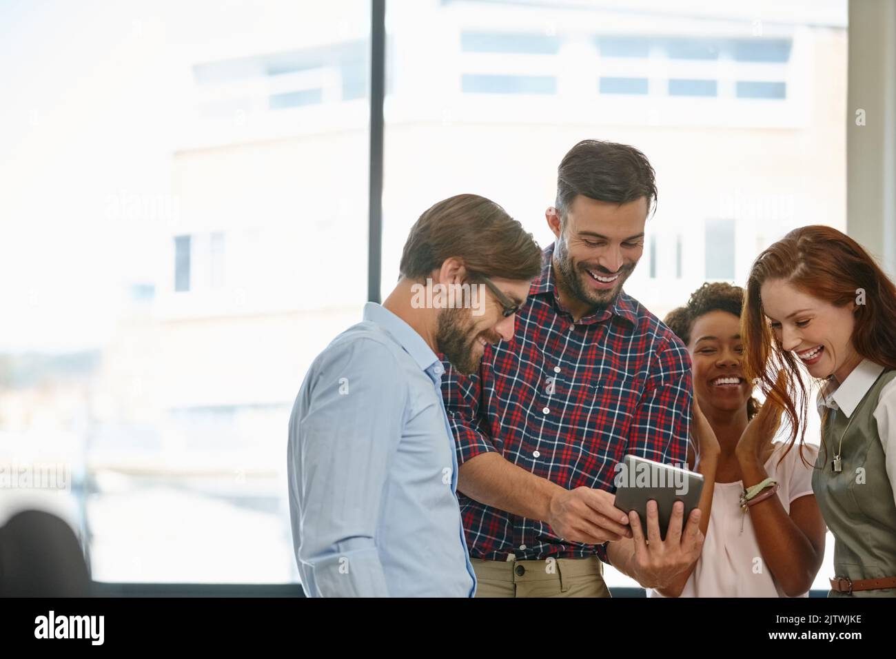 Liven up the working day with some laughter. a group of colleagues ...