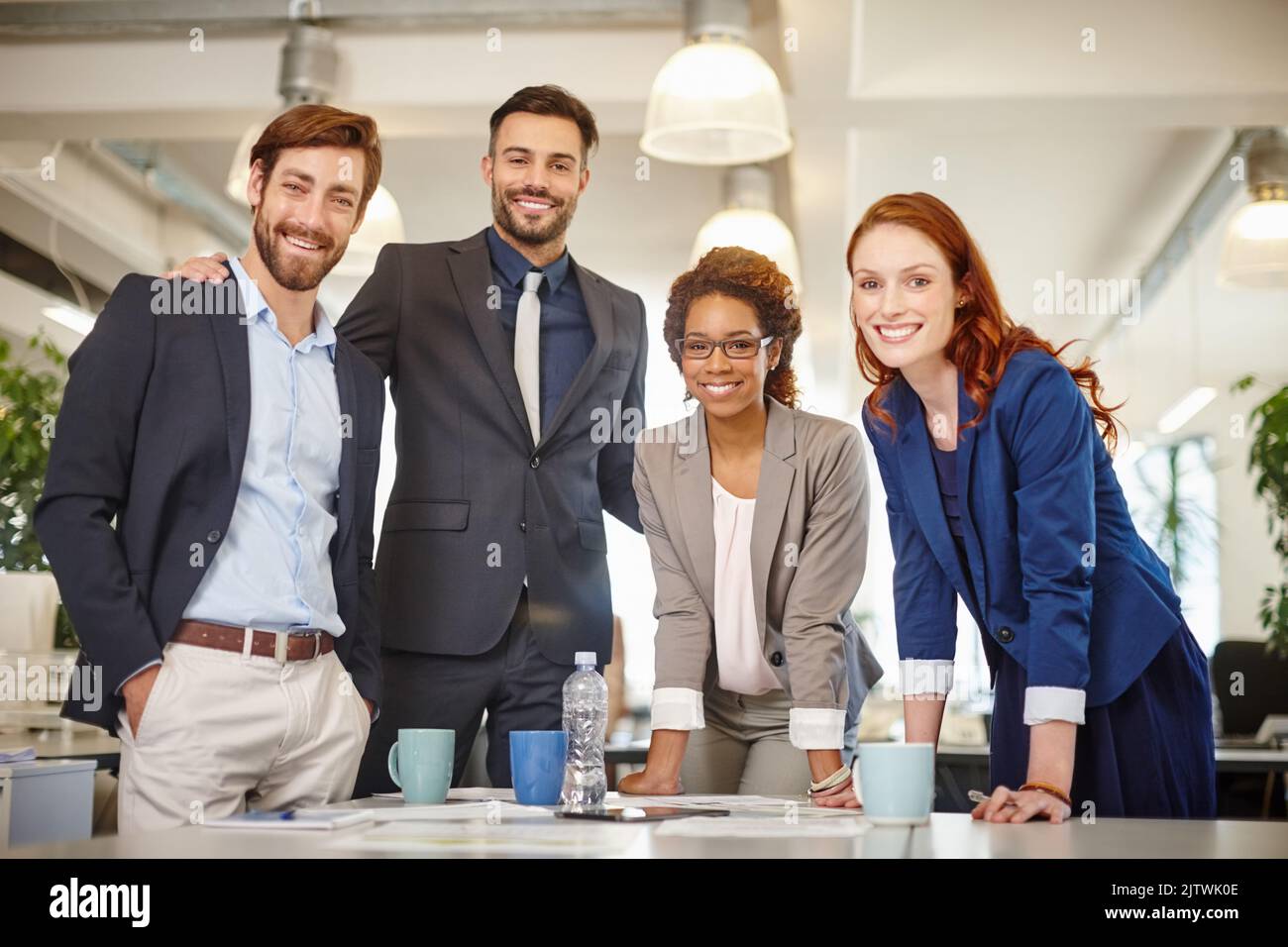 Were all about teamwork. Portrait of a group of colleagues having a ...