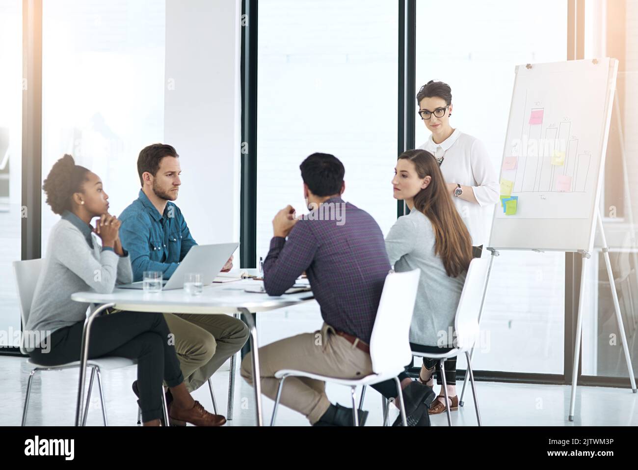 Achieving great work through team work. a businesswoman giving a ...