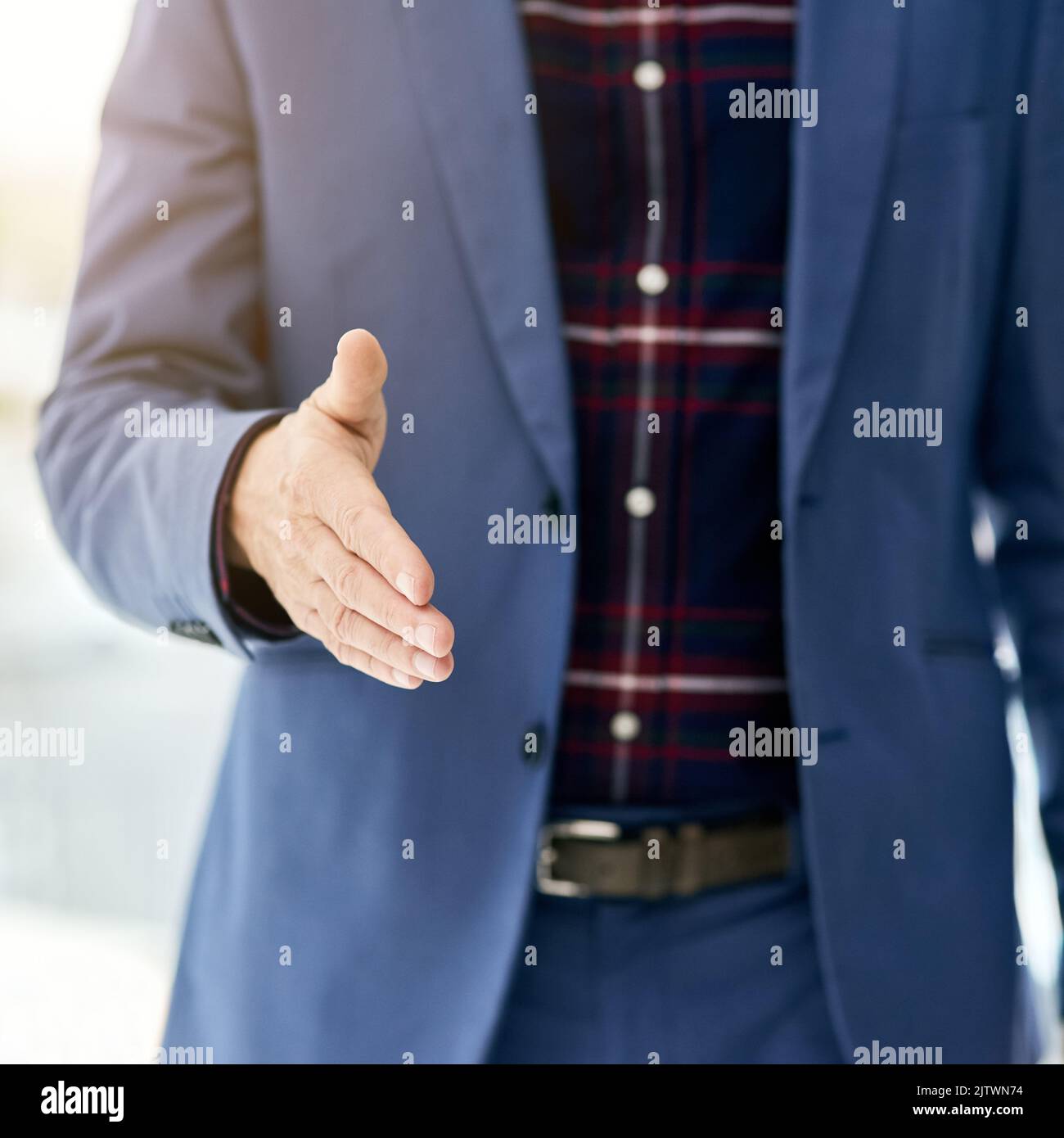 Allow me to welcome you...Closeup shot of a businessman gesturing for a ...